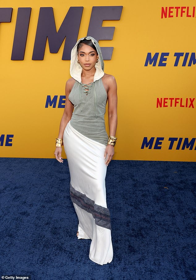 Lori Harvey Shows Off Her Sculpted Body In Slinky Hooded Dress As She