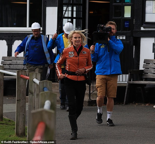 Anneka Rice, 63, dons an orange leather jacket while filming the reboot ...